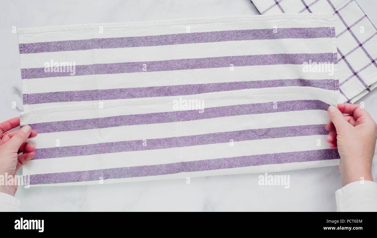 Folding blue and white patterned paper towels on marble surface Stock ...