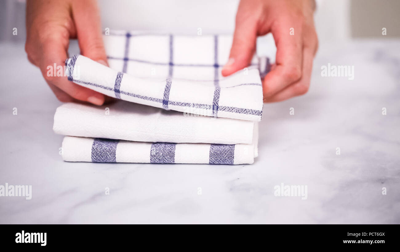Folding blue and white patterned paper towels on marble surface Stock ...