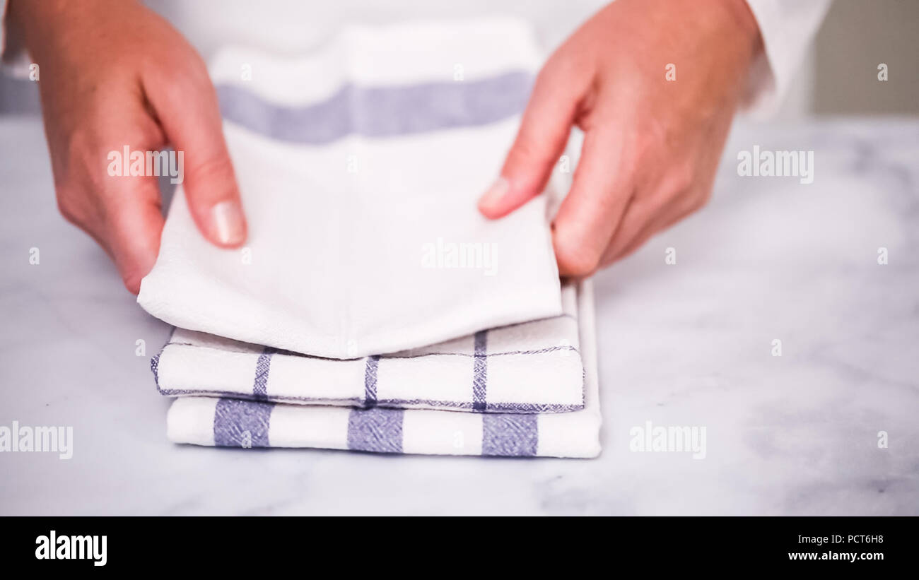 Folding blue and white patterned paper towels on marble surface Stock ...