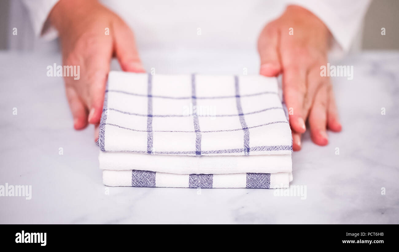 Folding blue and white patterned paper towels on marble surface Stock ...