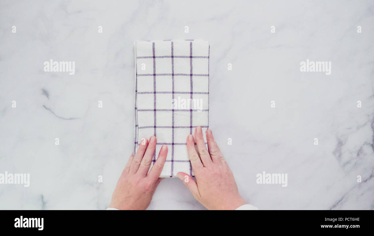 Folding blue and white patterned paper towels on marble surface Stock ...