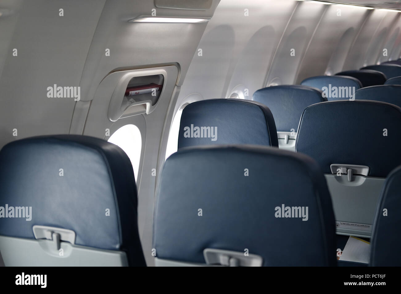 empty passenger seat inside airplane. row of chair in aircraft Stock ...