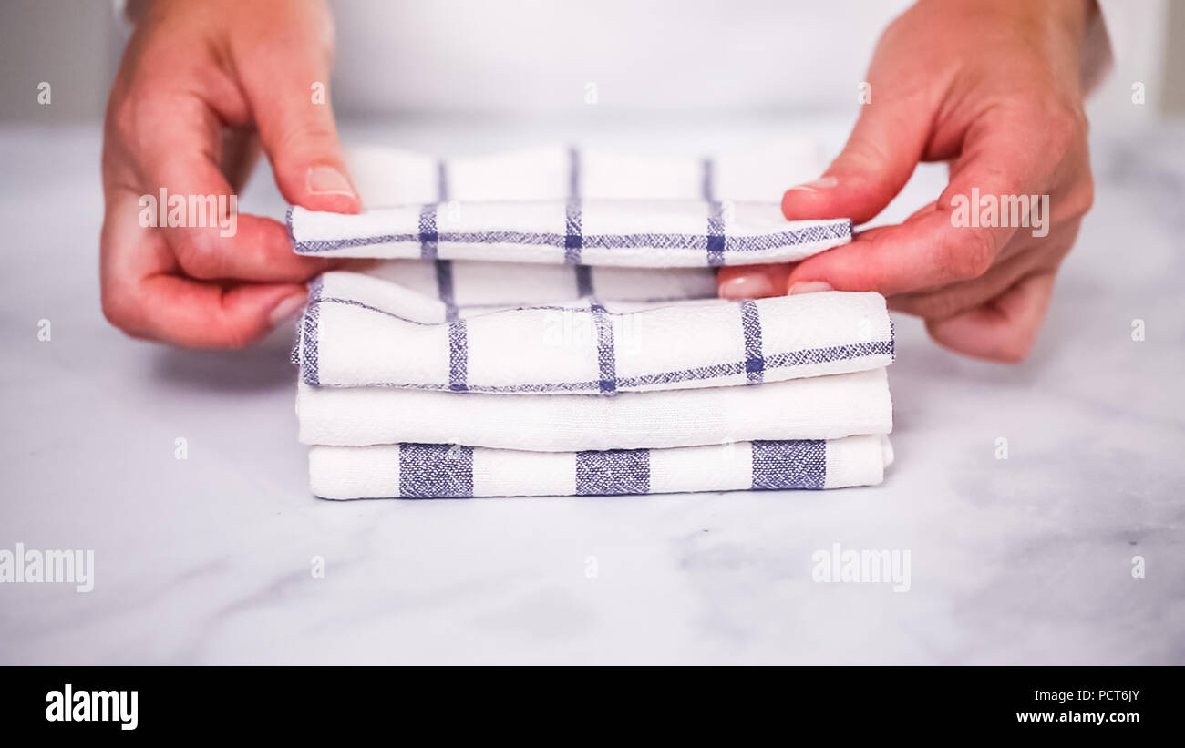 Folding blue and white patterned paper towels on marble surface Stock ...
