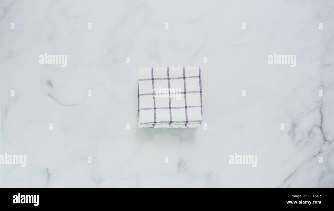 Folding blue and white patterned paper towels on marble surface Stock ...