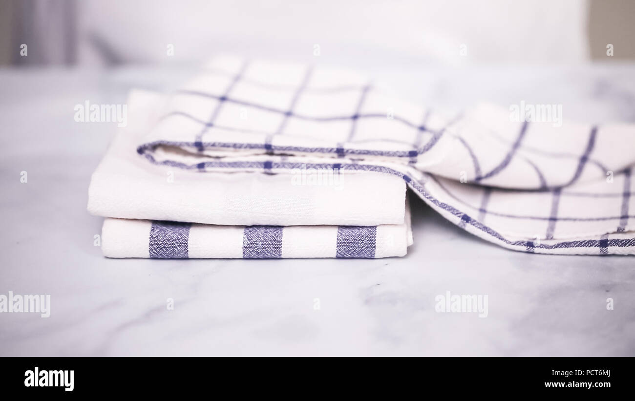 Folding blue and white patterned paper towels on marble surface Stock ...