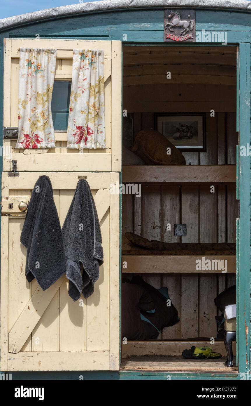an old road workers or navvies caravan on the back of a steam or ...