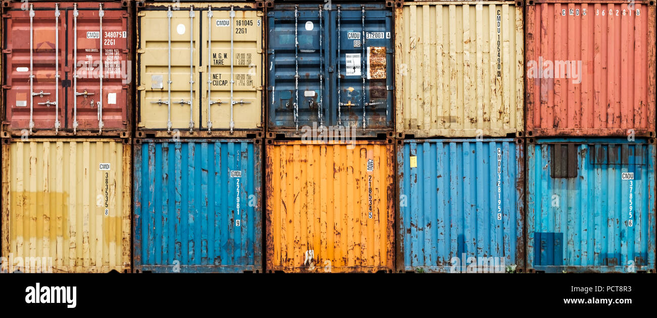 Stack of colorful and rusty containers Stock Photo - Alamy