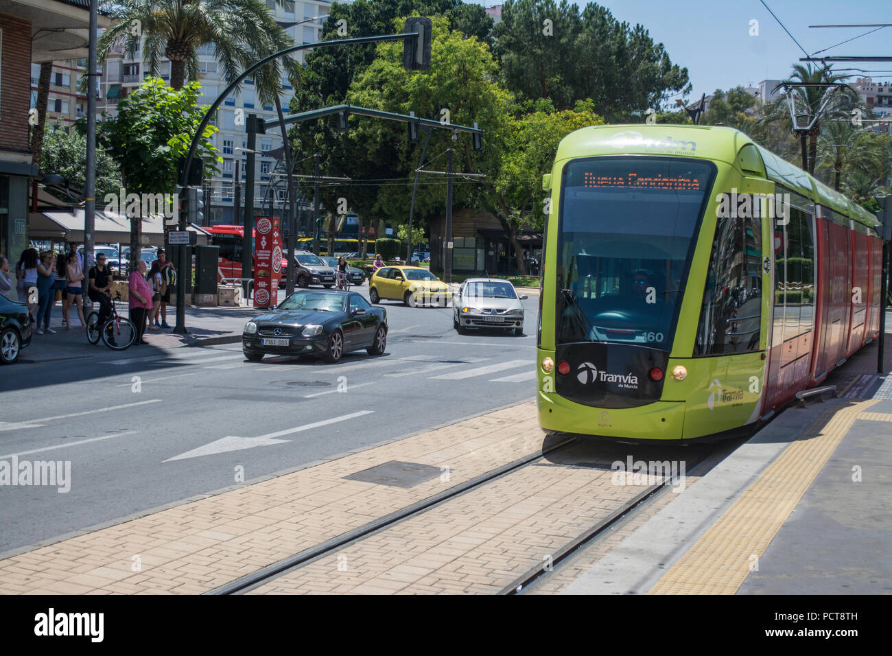 Tram arrives at the tram stop at the Plaza Circular in the Spanish City ...