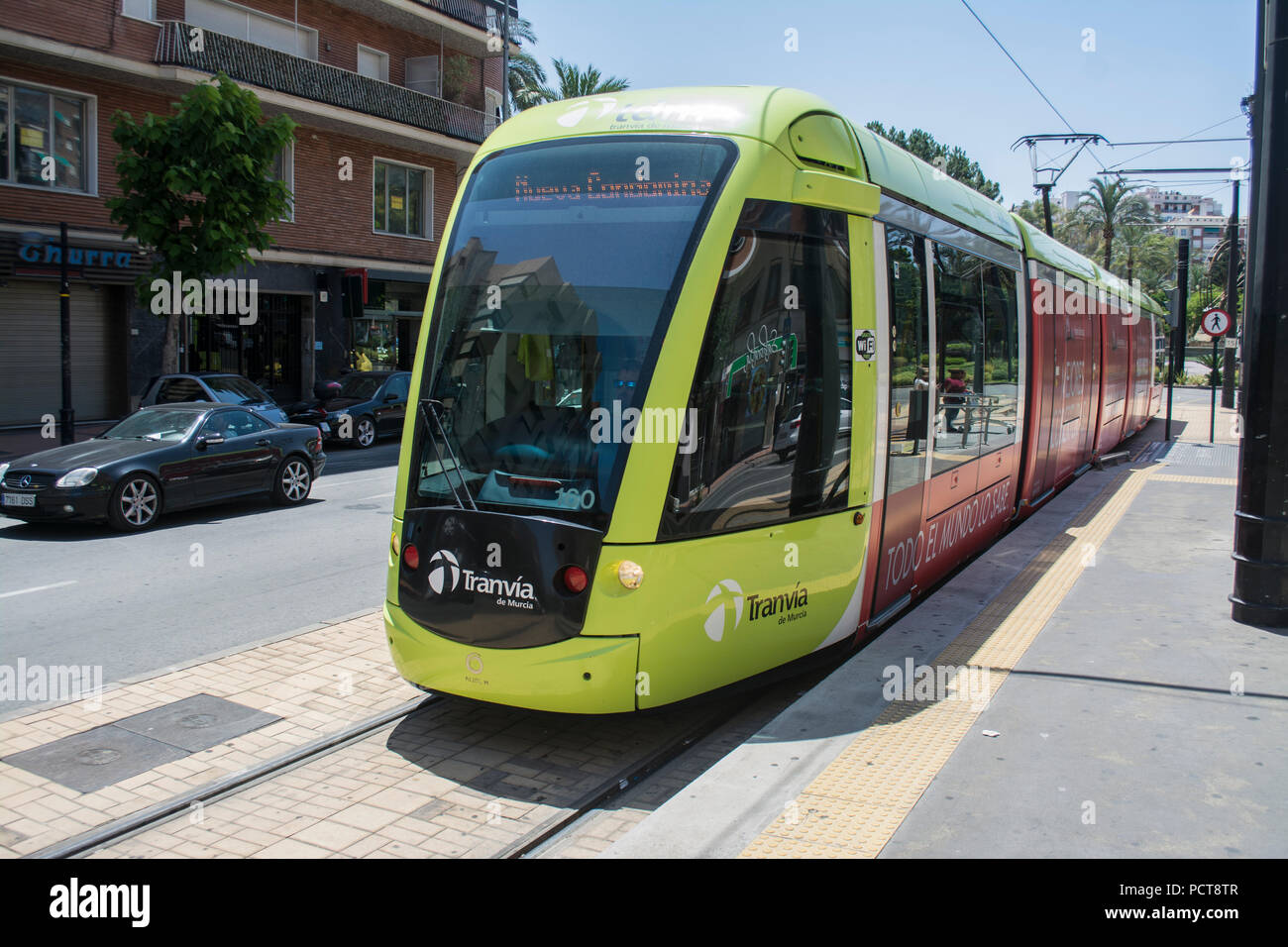 Tram arrives at the tram stop at the Plaza Circular in the Spanish City ...