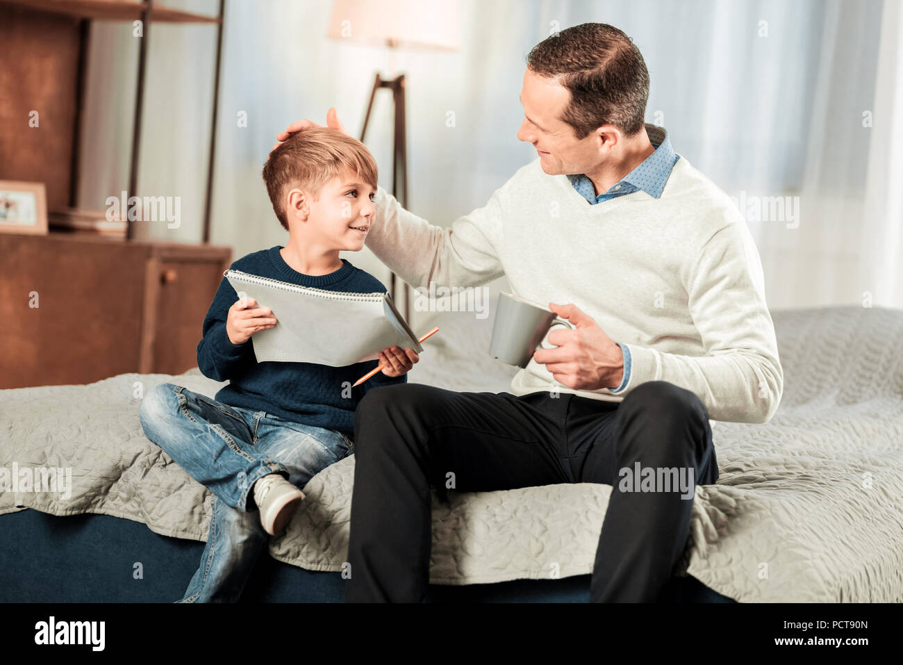 Happy joyful man talking to his son Stock Photo - Alamy