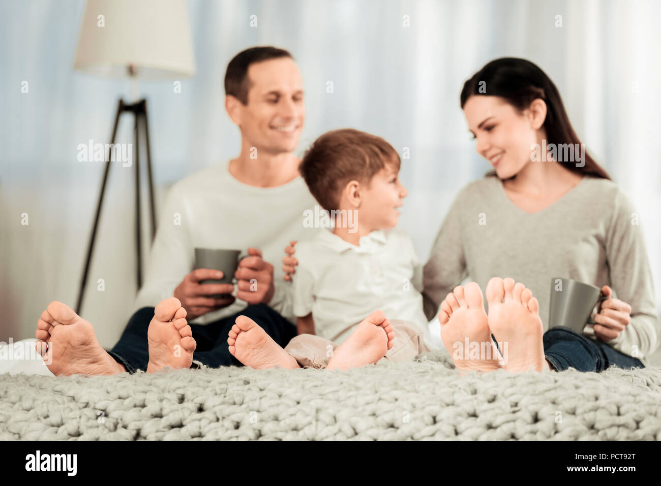 Selective focus of family members feet Stock Photo - Alamy