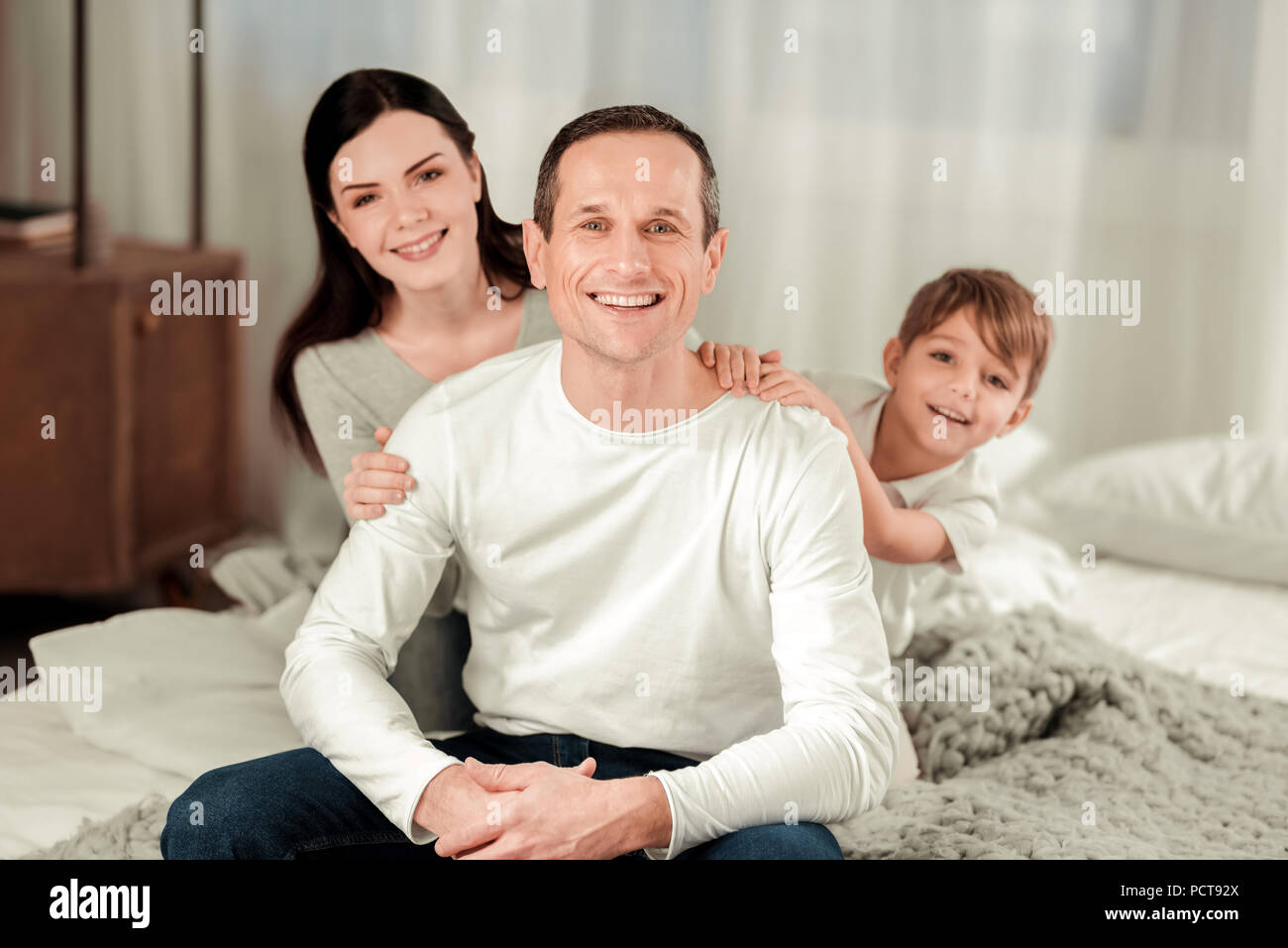 Happy nice man smiling to you Stock Photo - Alamy