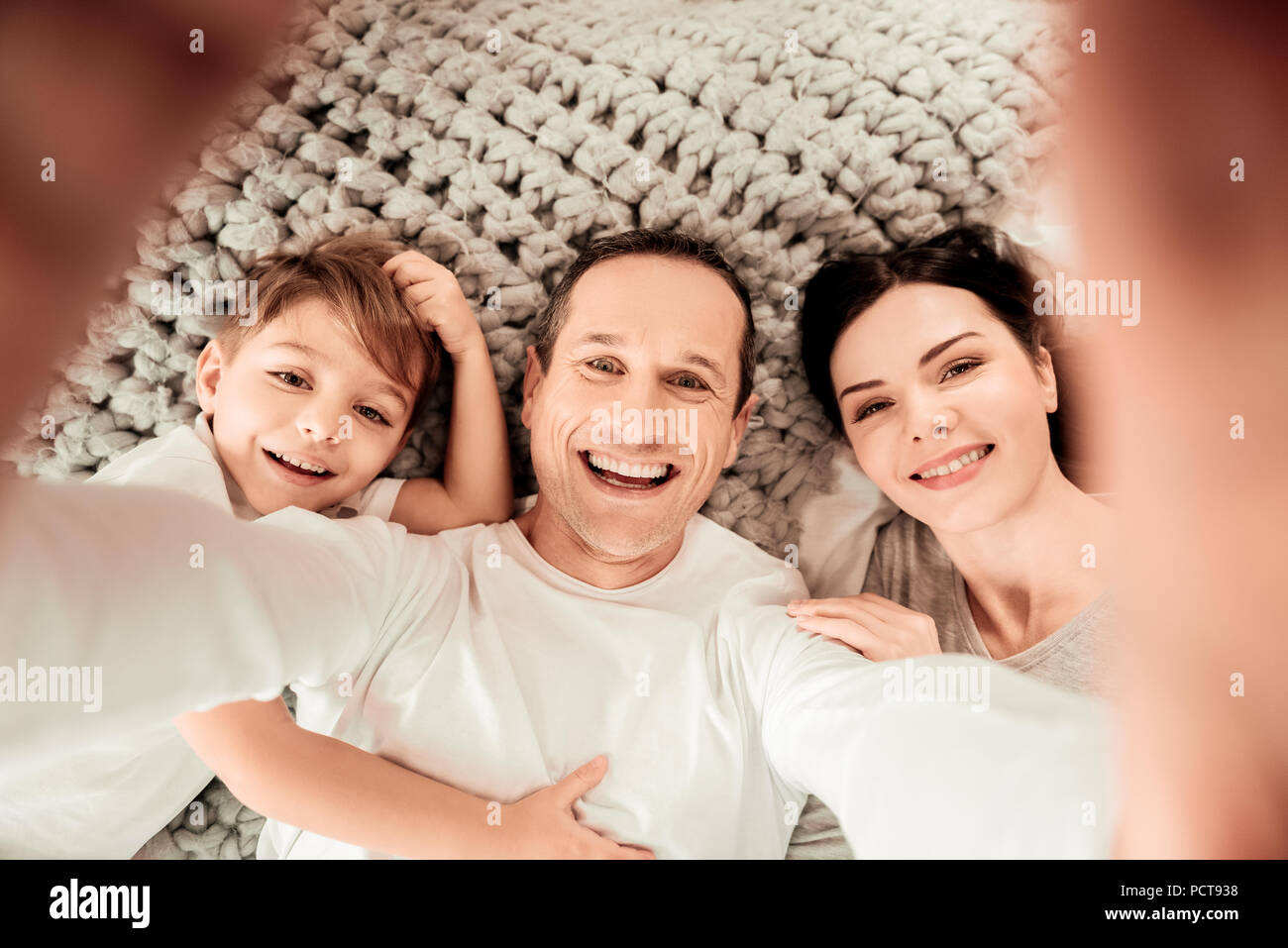 Happy delighted man holding a camera Stock Photo - Alamy