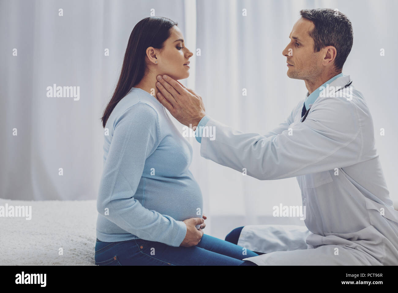 Professional doctor checking his patient Stock Photo - Alamy
