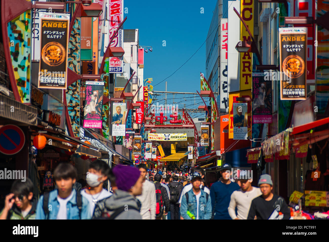 People stroll along the famous Ameyoko shopping street in Ueno District ...