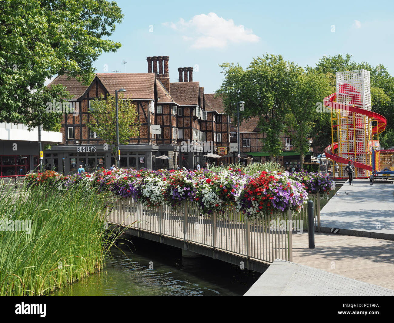 View of the foot bridge over The Pond in The Parade in Watford town ...