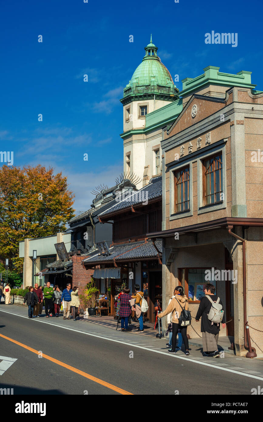 Tourists walking along Kurazukuri Street in the historic center of ...