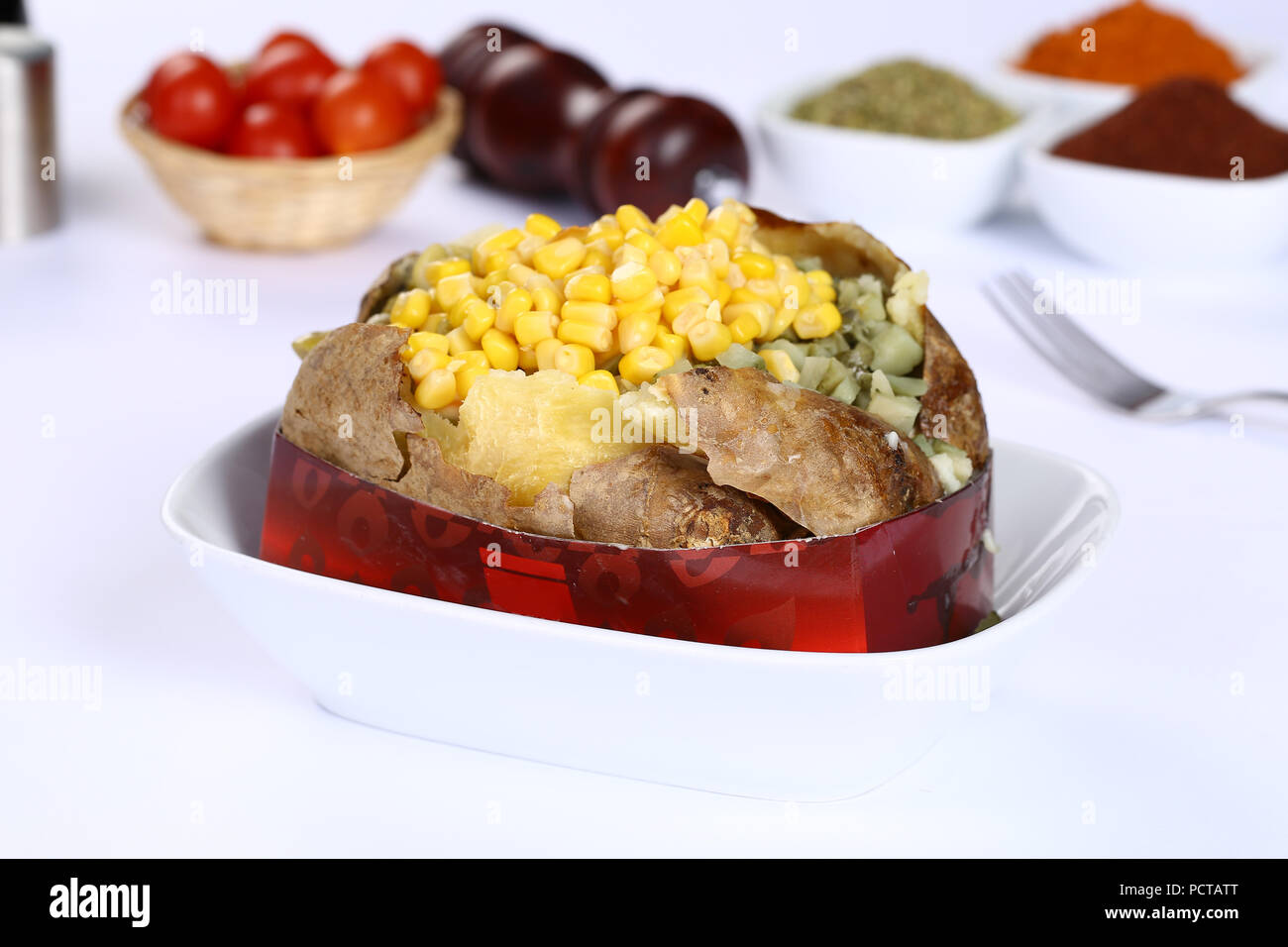 Kumpir, Turkish Baked potato with cheese, corn and sausage Stock Photo ...