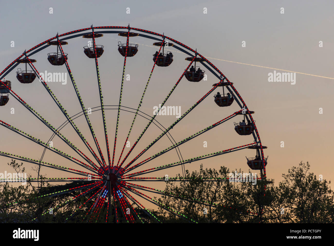 Ferris wheel at the spring festival in the evening hi-res stock ...