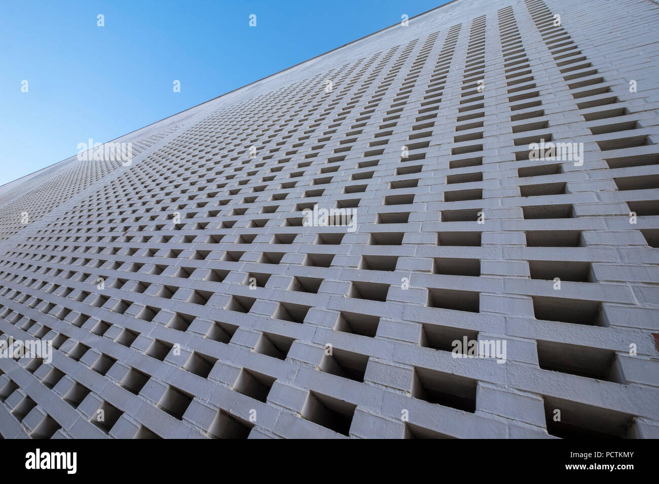 White wall with series of holes creating an abstract image hi-res stock ...