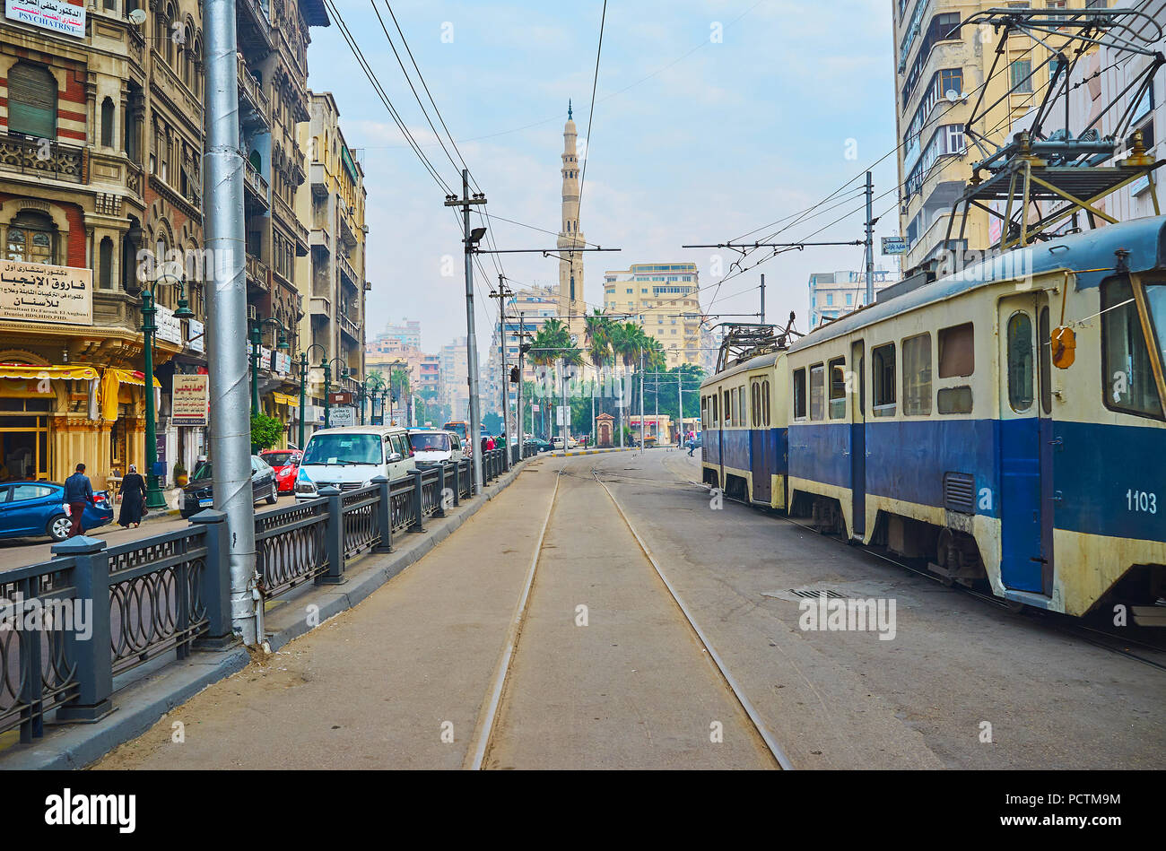 ALEXANDRIA, EGYPT - DECEMBER 18, 2017: The old blue tram rides along ...