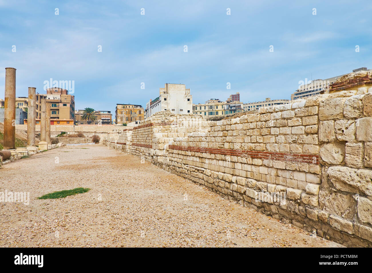 The ruins of the stone wall of Roman Auditorium stretch along the wide ...