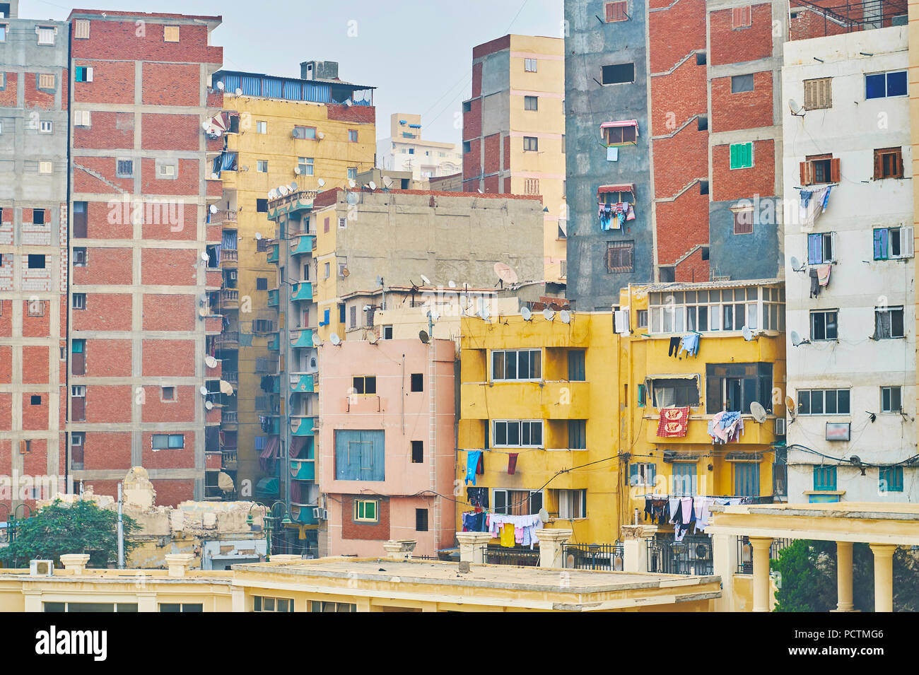 The poor quarters of Karmouz with narrow streets, unfinished high-rises ...