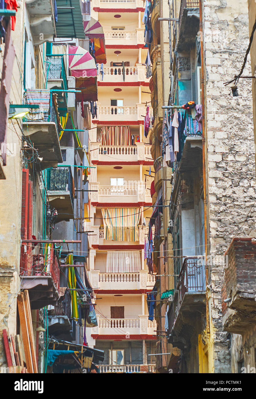 The narrow street in El Labban neighborhood with a view on the modern ...