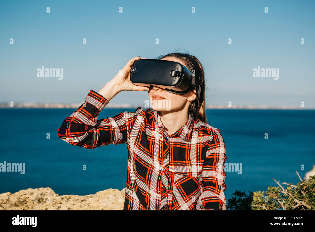 The girl in glasses of a virtual reality. Modern technology in everyday ...