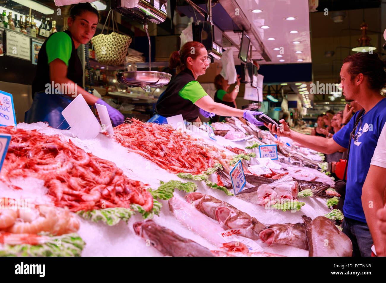Palma de Mallorca, Spain - July 07 2018: Sellers, shoppers and counter ...