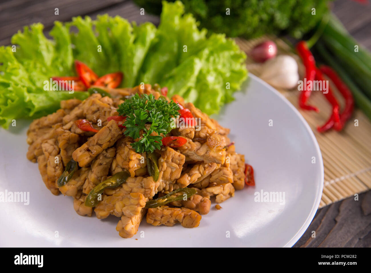 oseng tempe, stir fry tempe soybean indonesian food Stock Photo - Alamy