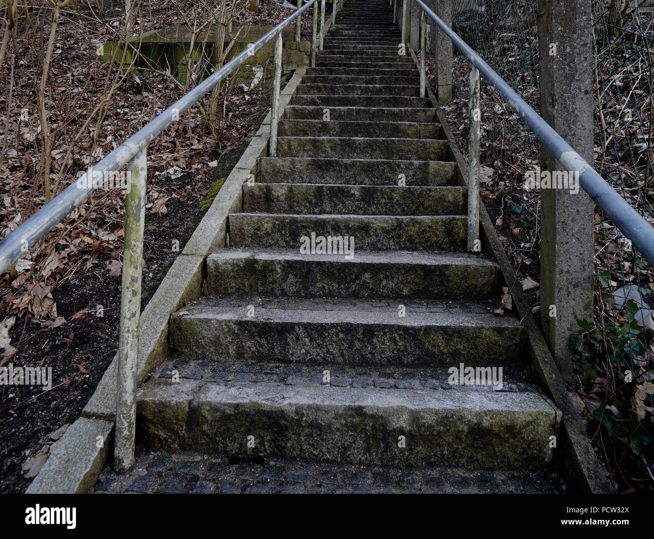 Germany, Bavaria, Upper Bavaria, Neuötting, weathered stone stairs with ...