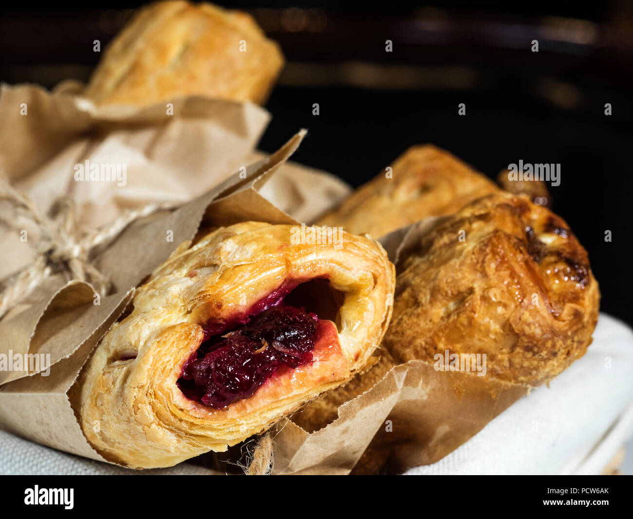 rolls of puff pastry with fruit jam Stock Photo - Alamy