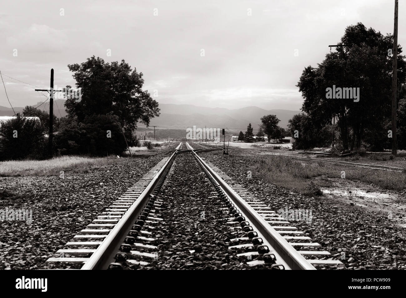 Fine art sepia photo of train tracks vanishinginto the horizon with a ...