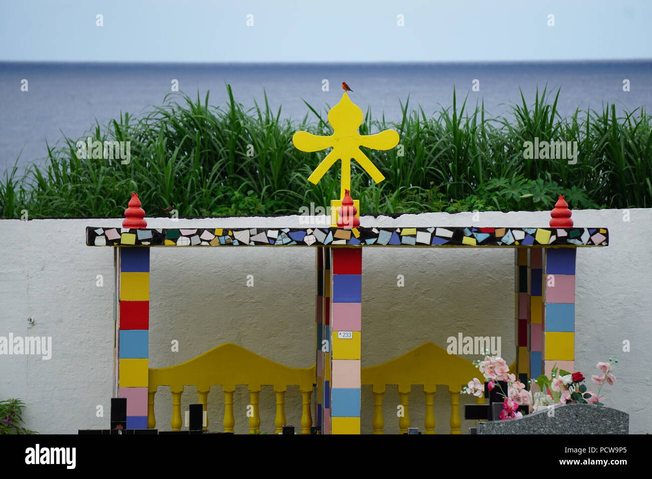A colorful, beautiful and unusual tombstone with an ocean view and a ...