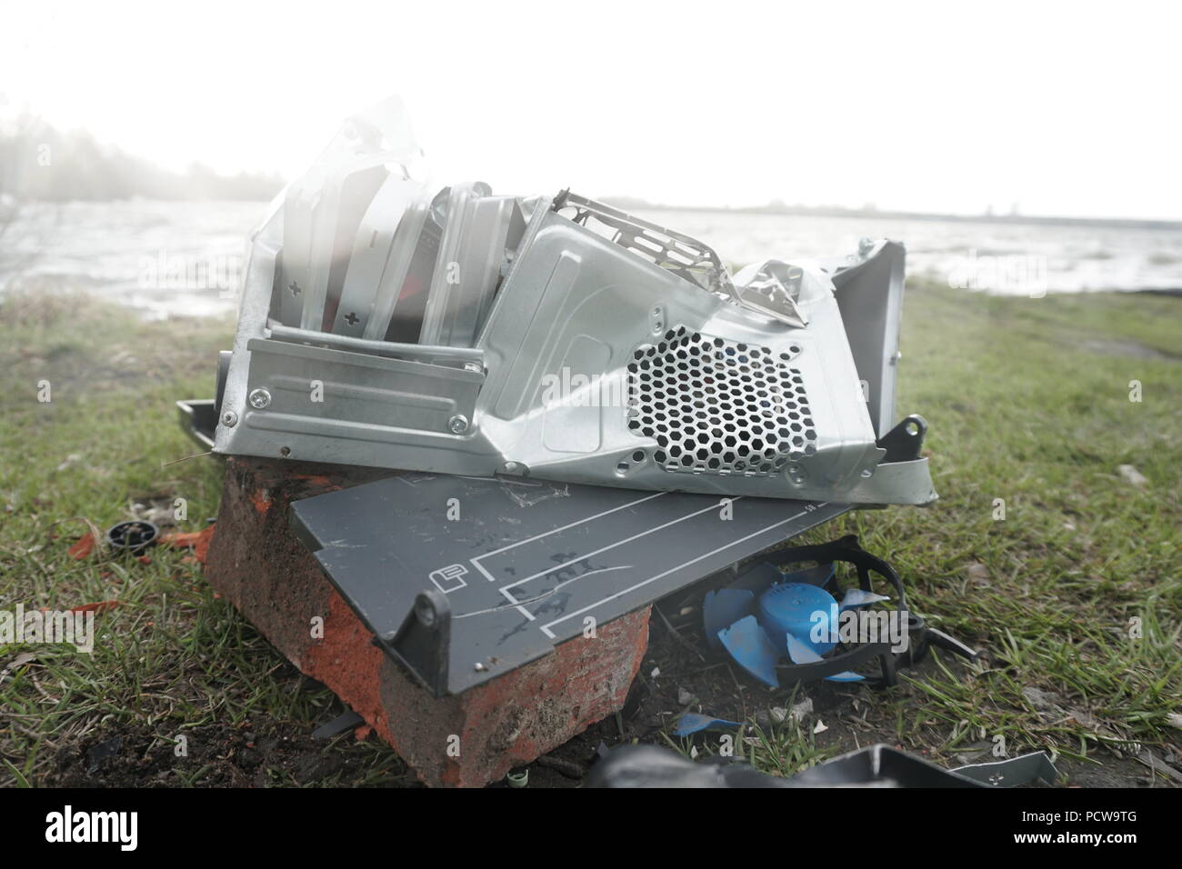 Man breaks a hammer system unit computer. Man with a sledge hammer and ...