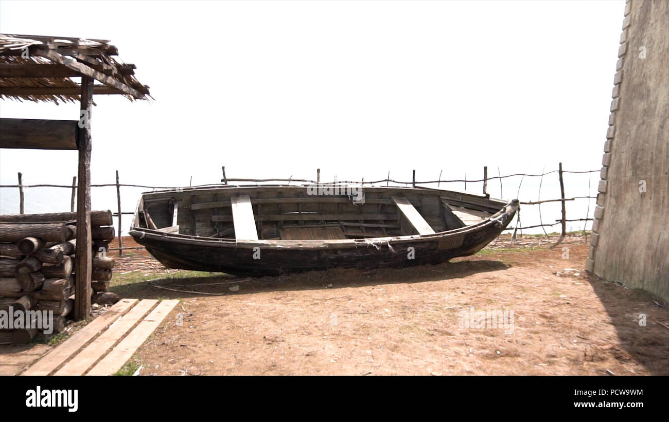 Old rusty wooden boat. Old abandoned rowboat on a beach. Video. Old ...