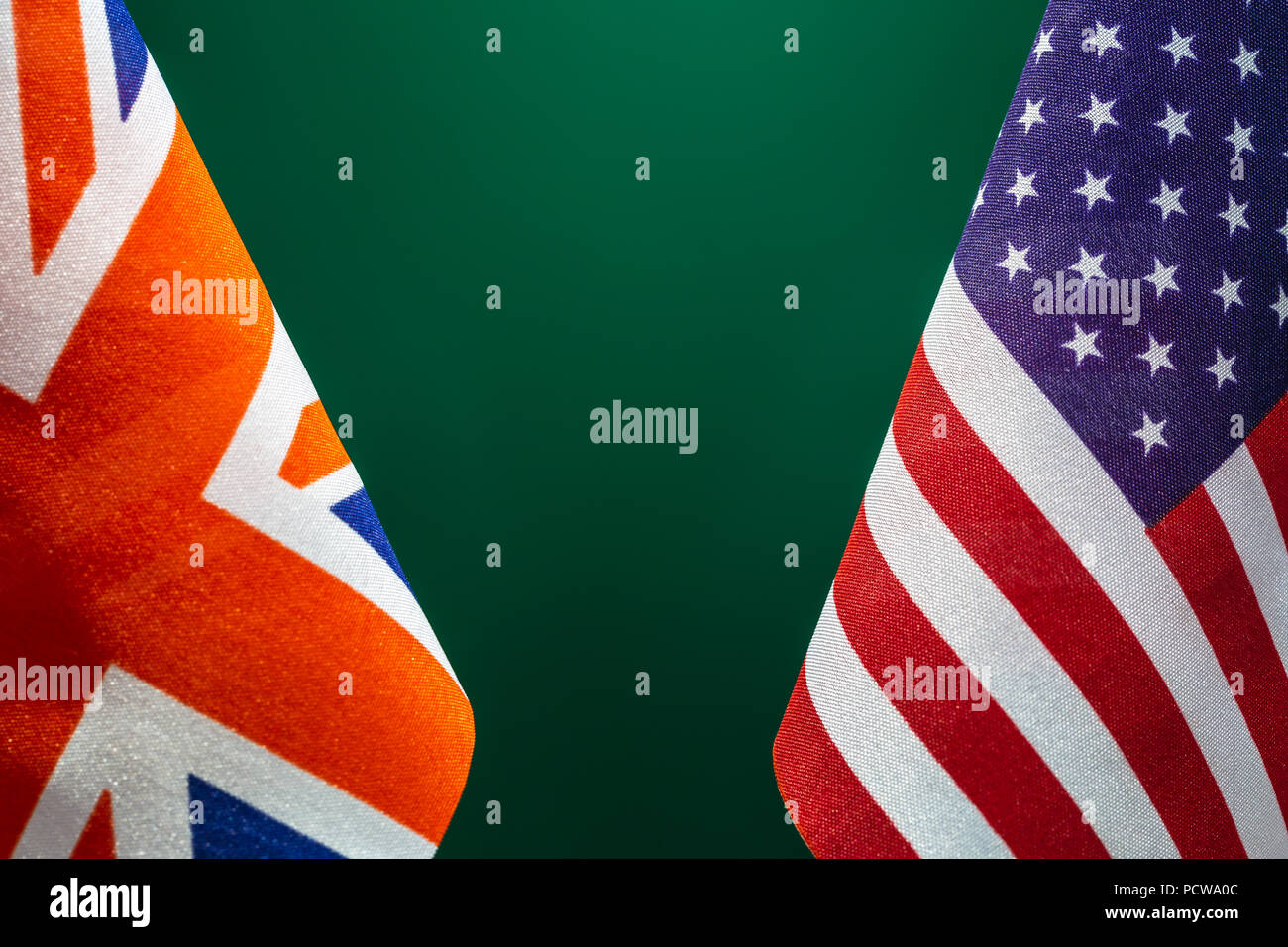 Flags United State of America and Great Britain with green background ...