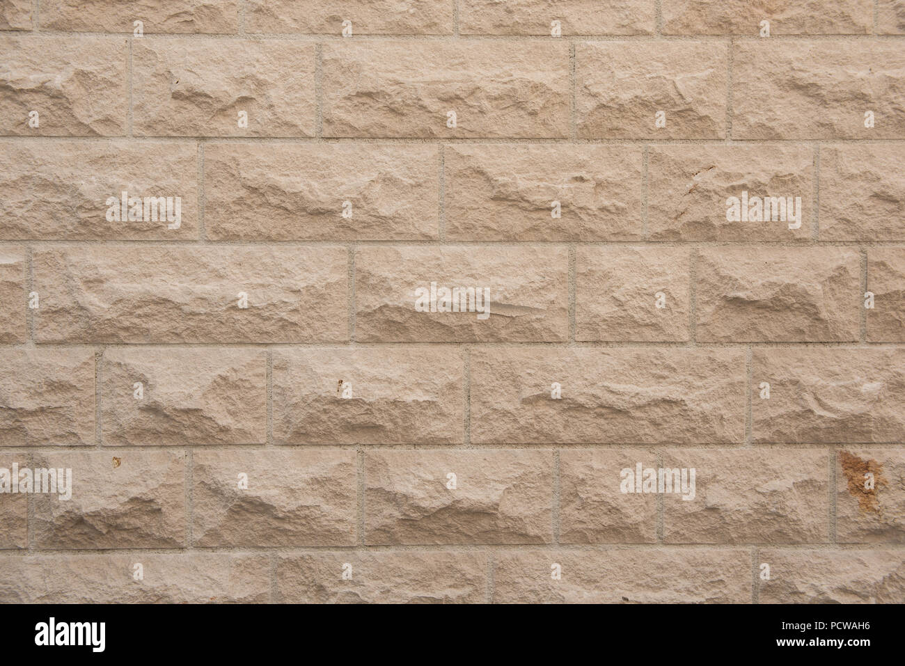 Beige stone wall as background Stock Photo - Alamy