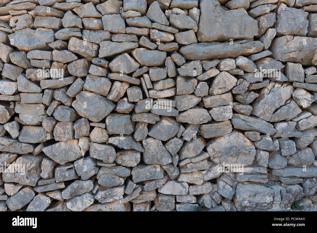 Old grey dry wall, stone surface as background, wallpaper Stock Photo ...