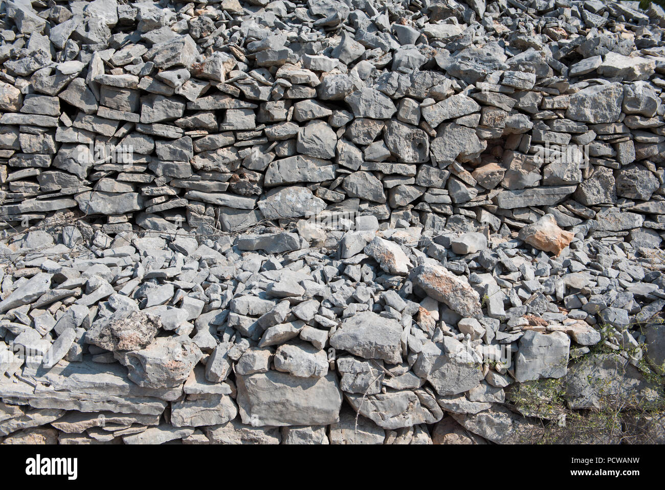 Old grey stone dry wall as background. Stone surface. Dry stack ...
