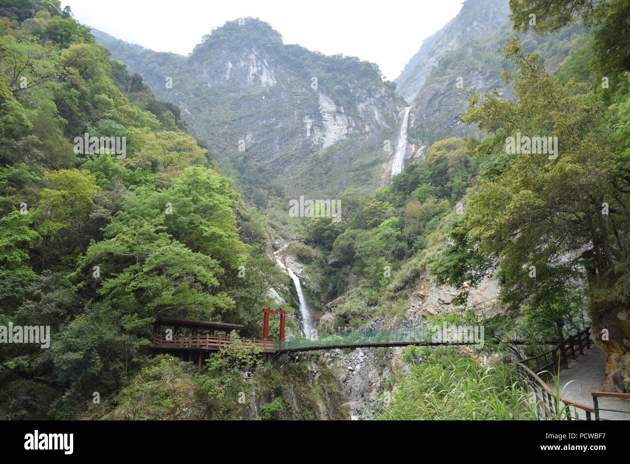 Pedestrian bridge and waterfall inside Taroko National Park in Hualien ...