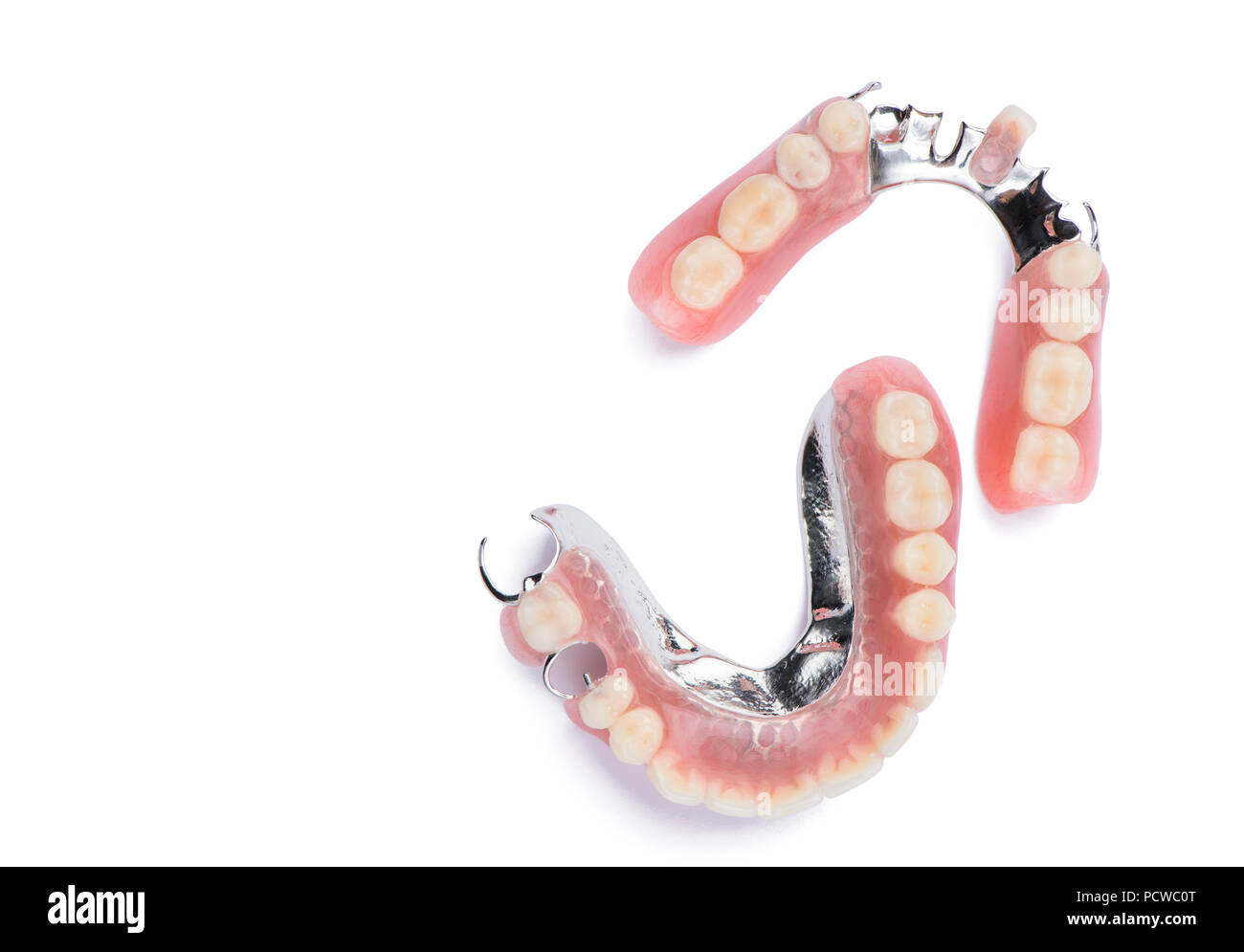 Dentures on white background Stock Photo - Alamy