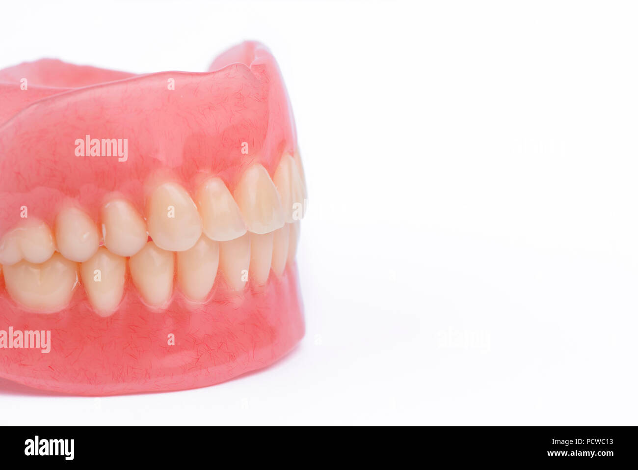 Full denture dentures close-up on white background Stock Photo - Alamy
