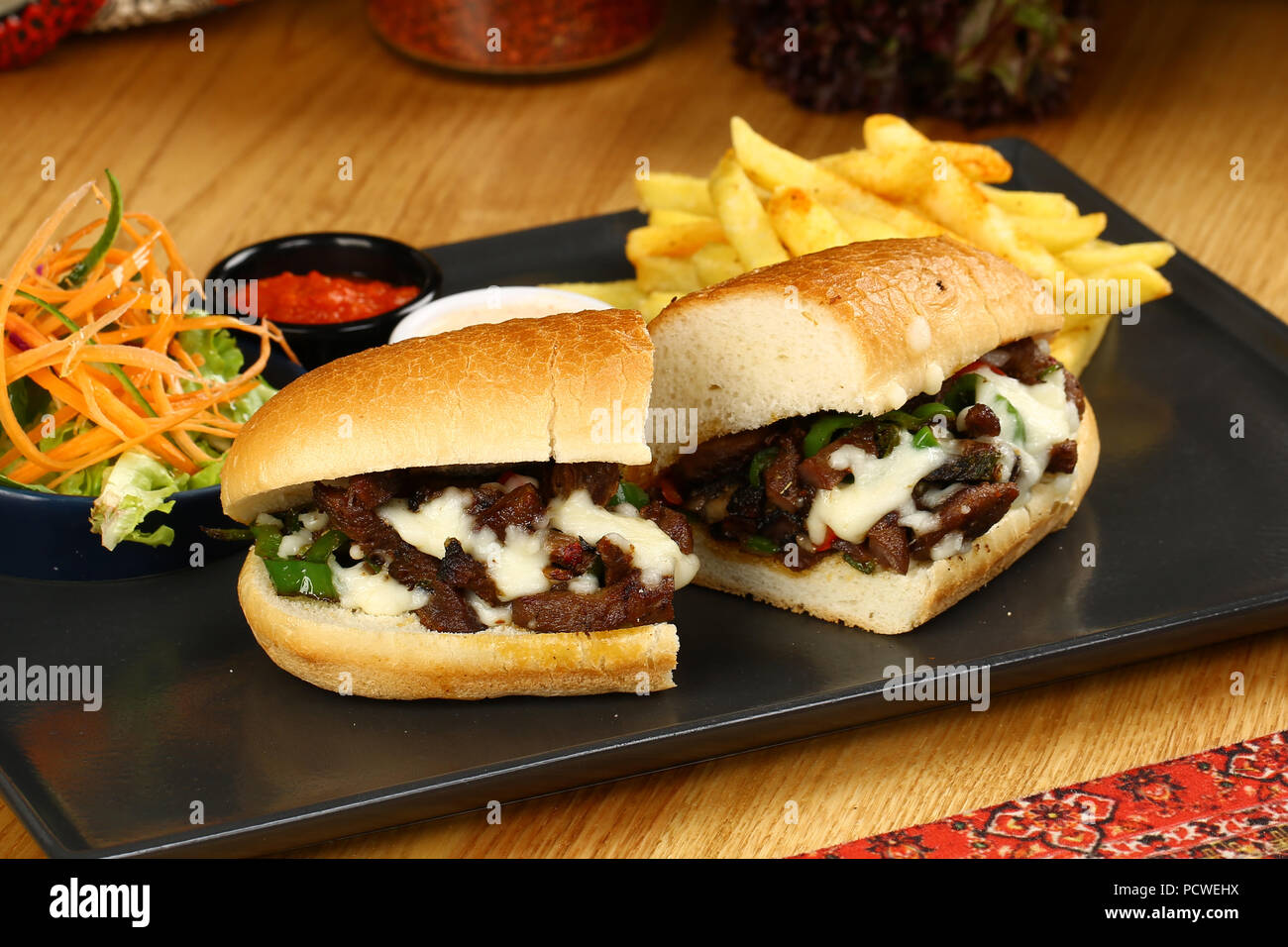 Philly beef steak cheese submarine sandwich Stock Photo - Alamy