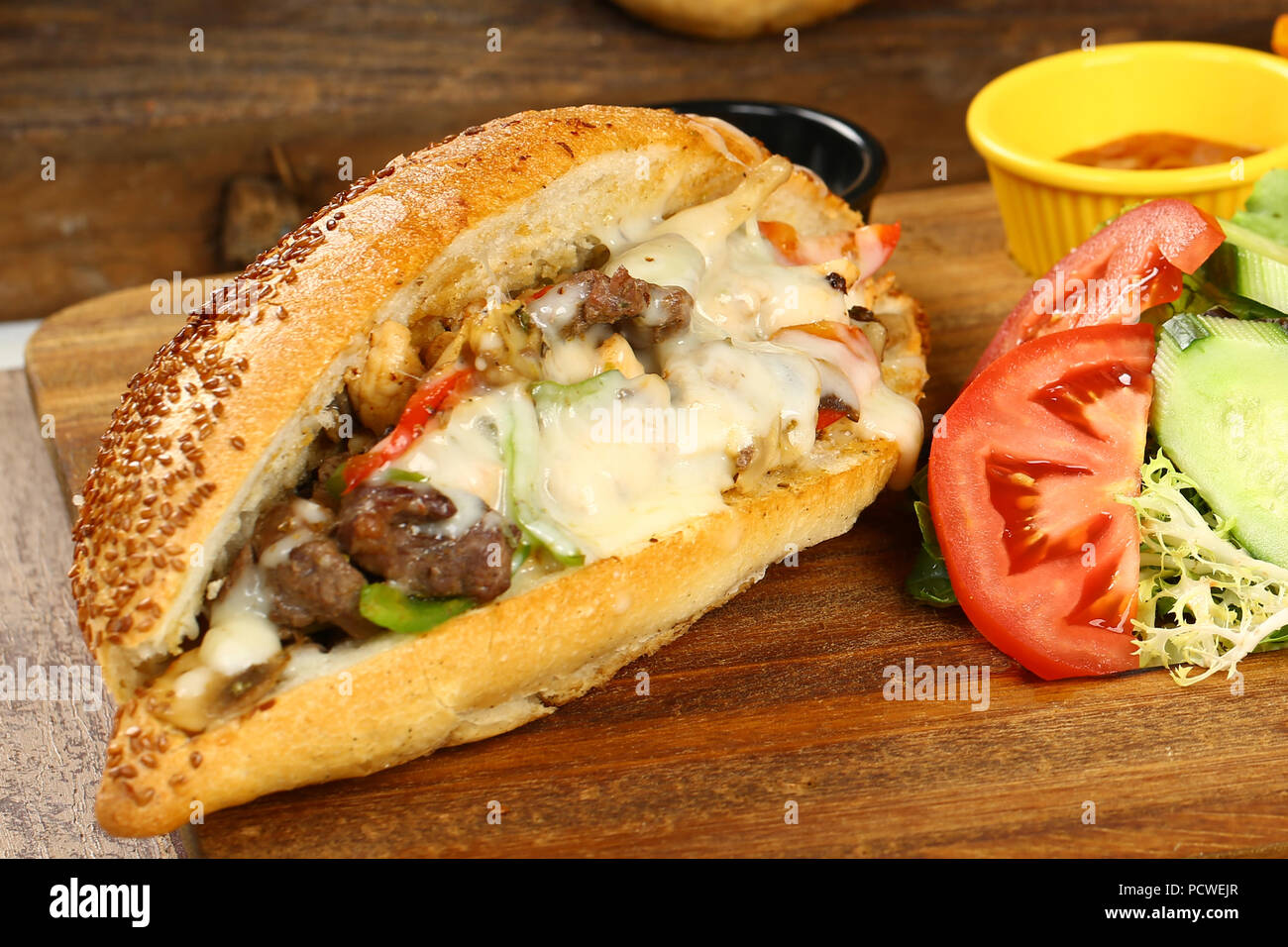 Philly beef steak cheese submarine sandwich Stock Photo - Alamy