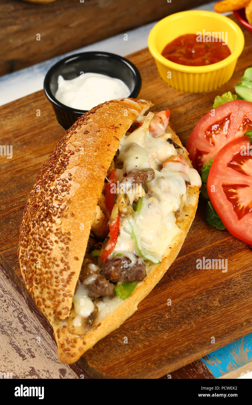 Philly beef steak cheese submarine sandwich Stock Photo - Alamy