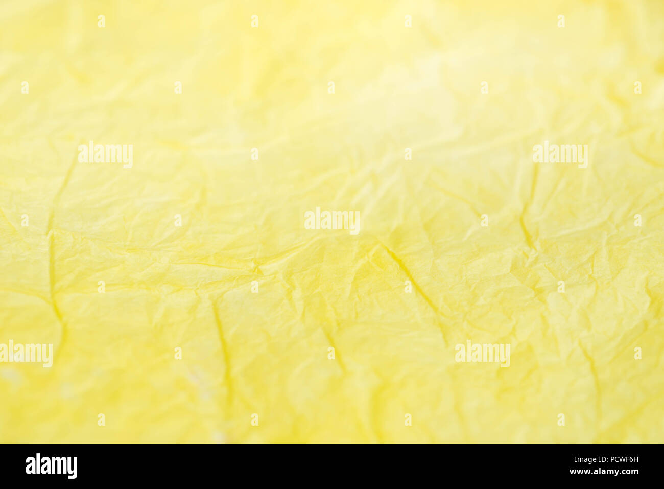 yellow color creased paper tissue texture background Stock Photo - Alamy