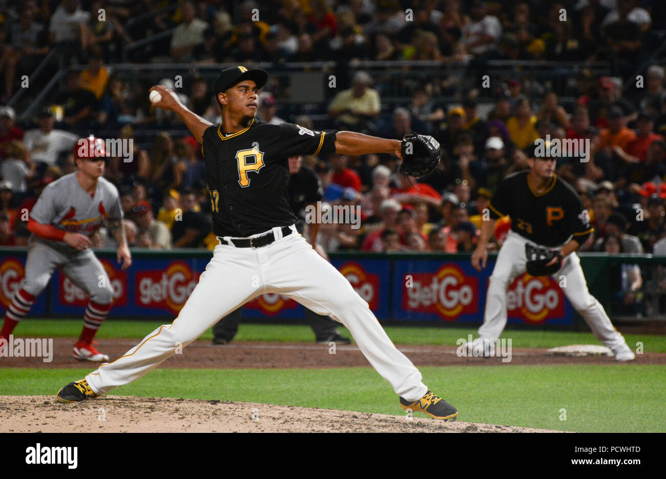 Pittsburgh Pirate #37 Edgar Santana pitching at a 2018 game against the ...