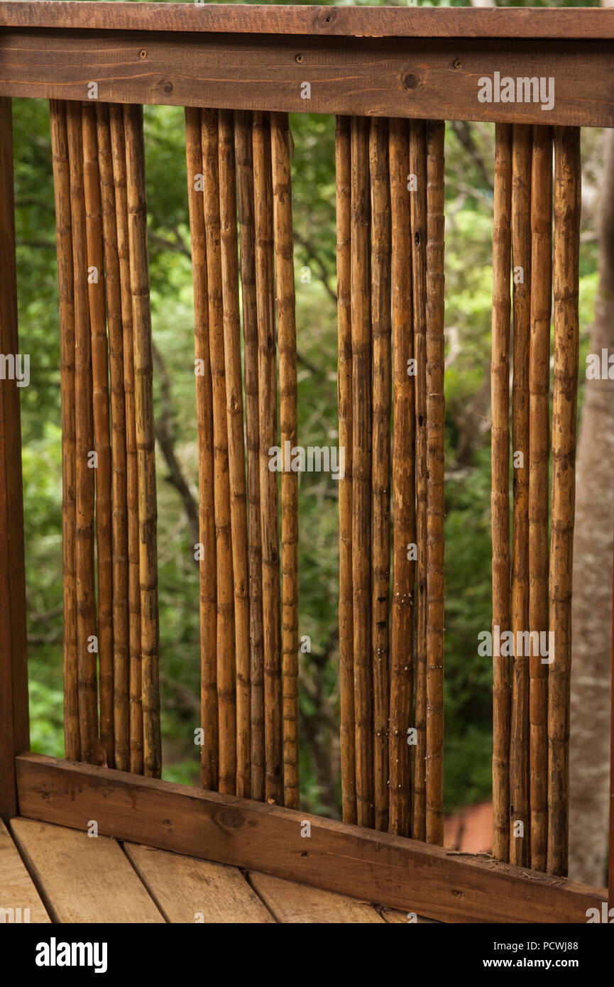 Tropical deck railing constructed with wood and bamboo rods Stock Photo ...